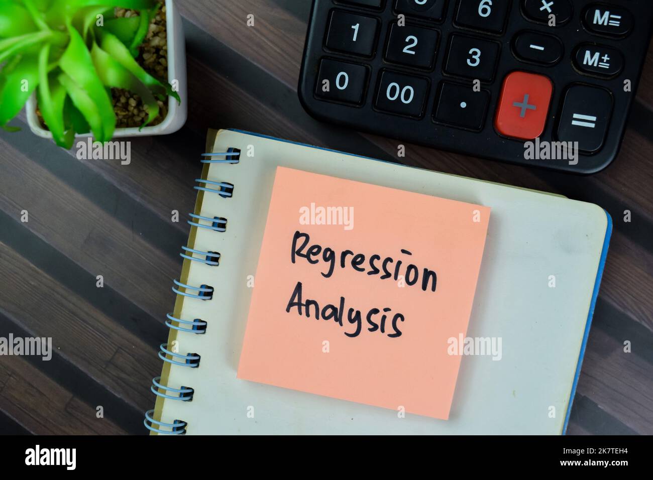 Concept of Regression Analysis write on sticky notes isolated on Wooden ...