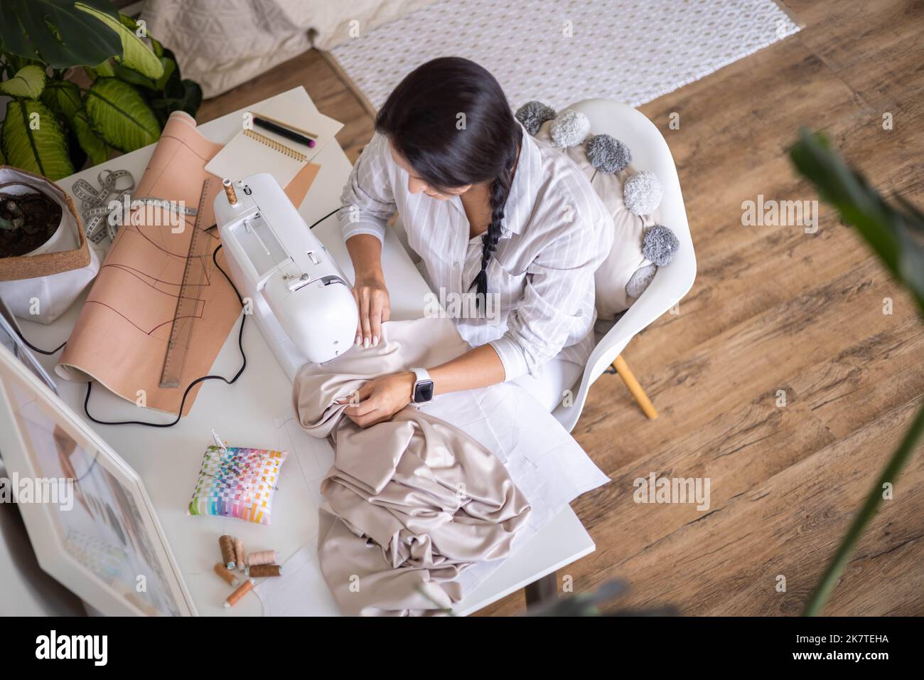 Female skilled dressmaker sews hi-res stock photography and images - Alamy