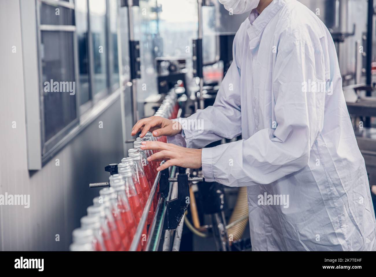 food and drink industry staff worker working at conveyor belt ...