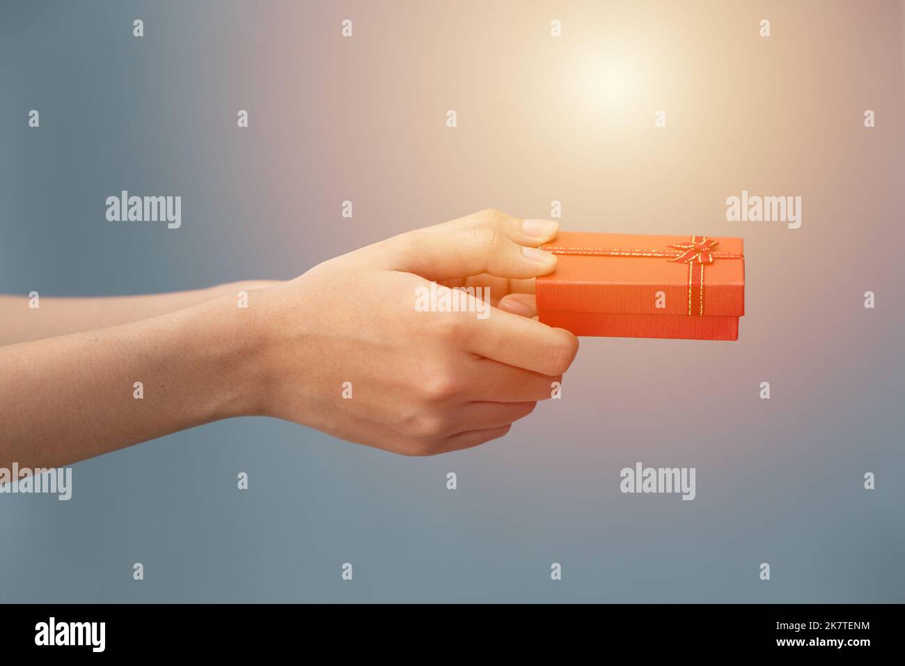 closeup hand holding small gift box for thanks giving precious present ...