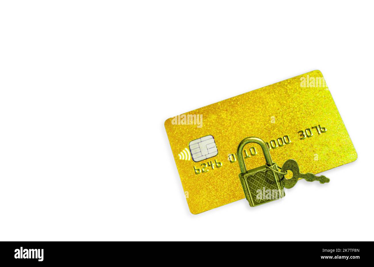 Padlock and key placed on a golden credit card isolated on white ...