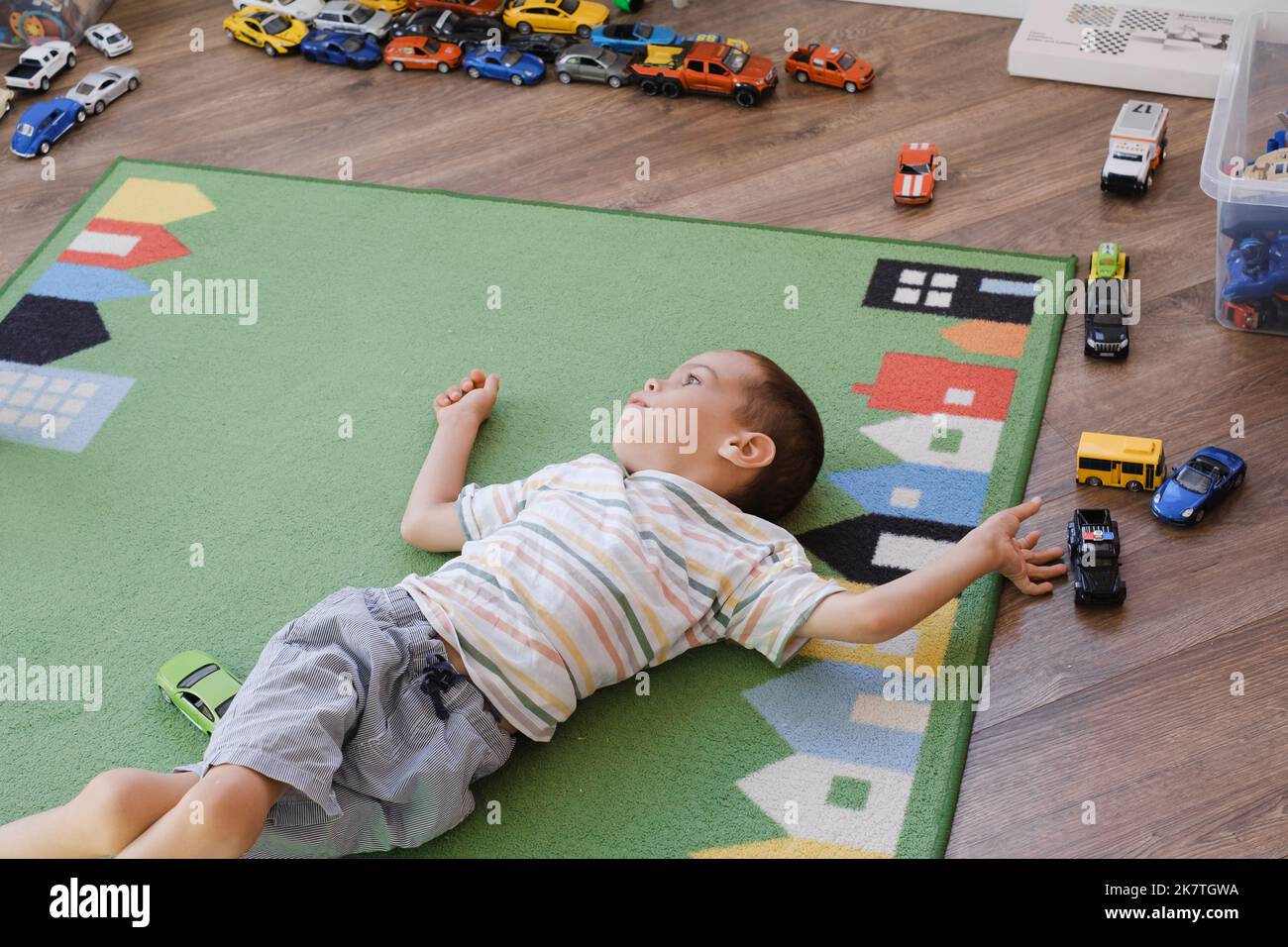 Child with cerebral palsy playing on mat, having fun. Kid having ...