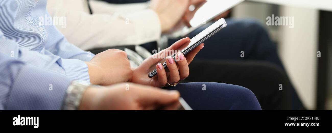 People using phones on meeting hi-res stock photography and images - Alamy