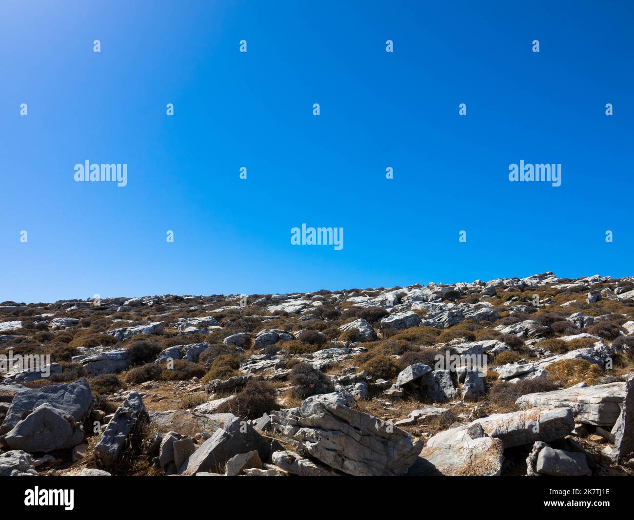 Rocks and stones on the mountain top of Attavyros mountain. Arid ...