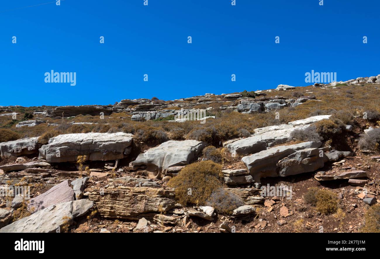 Rocks and stones on the mountain top of Attavyros mountain. Arid ...