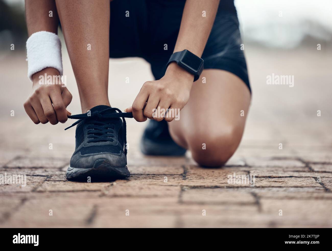 Running sneakers, fitness and woman athlete tie lace in outdoor cardio ...