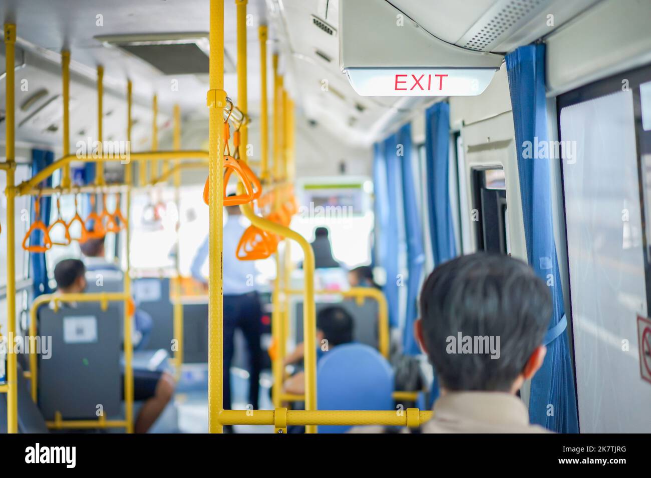 Exit sign light box is hung on the ceiling inside the bus, Thailand ...