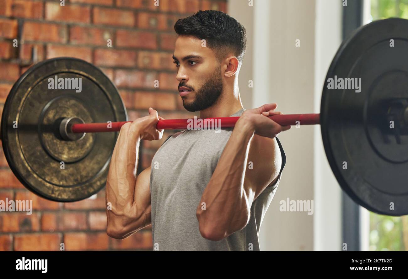 Youre never too busy to work on a better you. a young man working out ...
