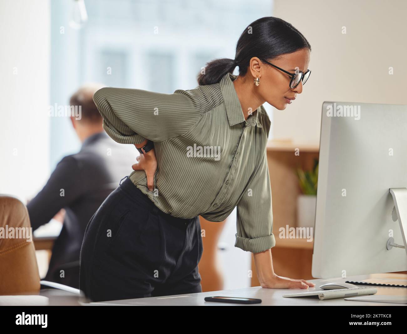 Woman back ache office desk hi-res stock photography and images - Alamy