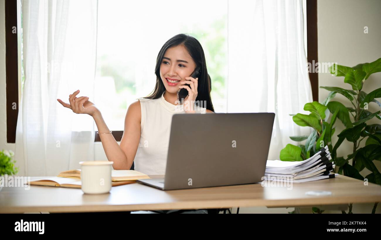 Gorgeous and professional millennial Asian female boss or female account executive manager is ...