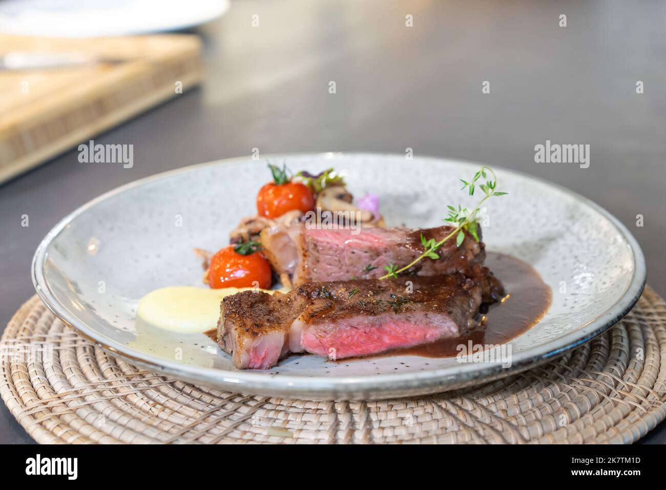 Medium Rare Beef Steak was grilled and fried with sliced mushroom and ...