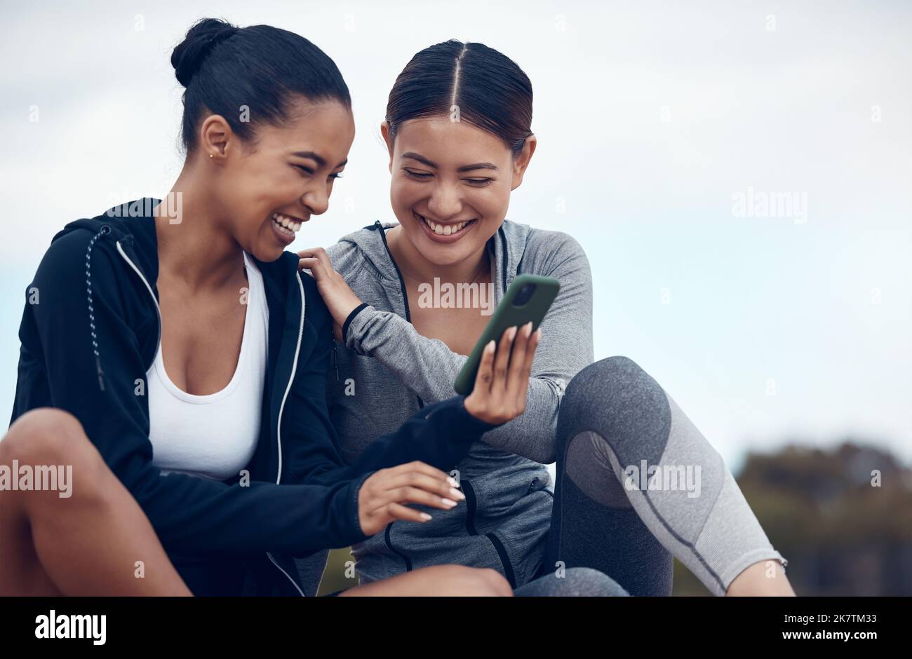 Fitness, relax and friends on phone after exercise networking on social ...