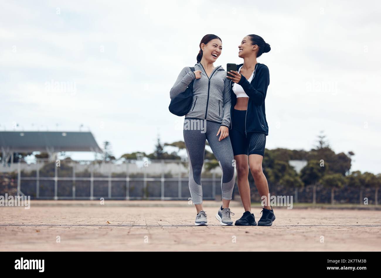 Fitness, friends and women laugh at phone while walking to gym, fun and ...