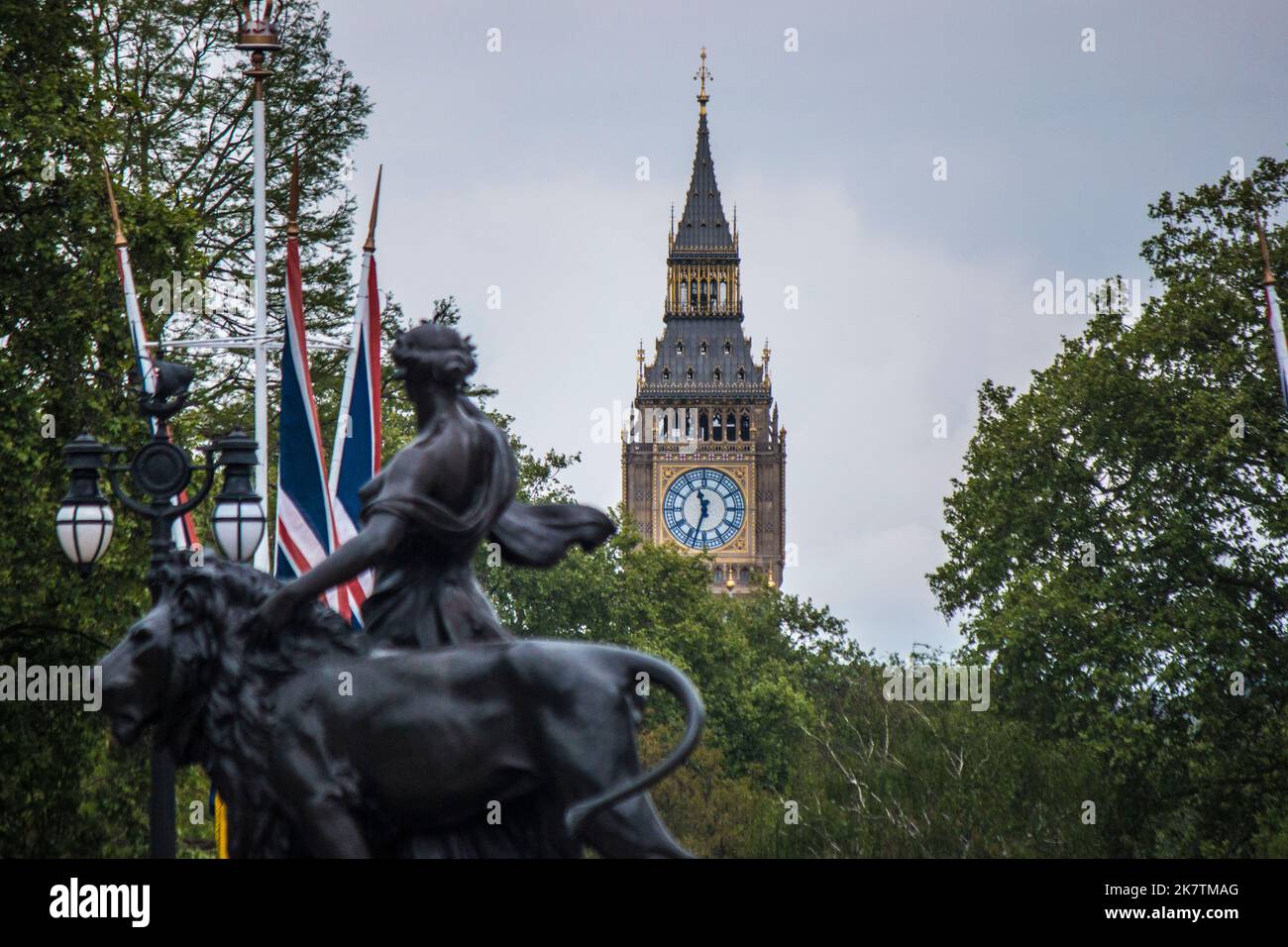 Queen Victoria looking towards Big ben (st.Stephens tower) with a lion ...
