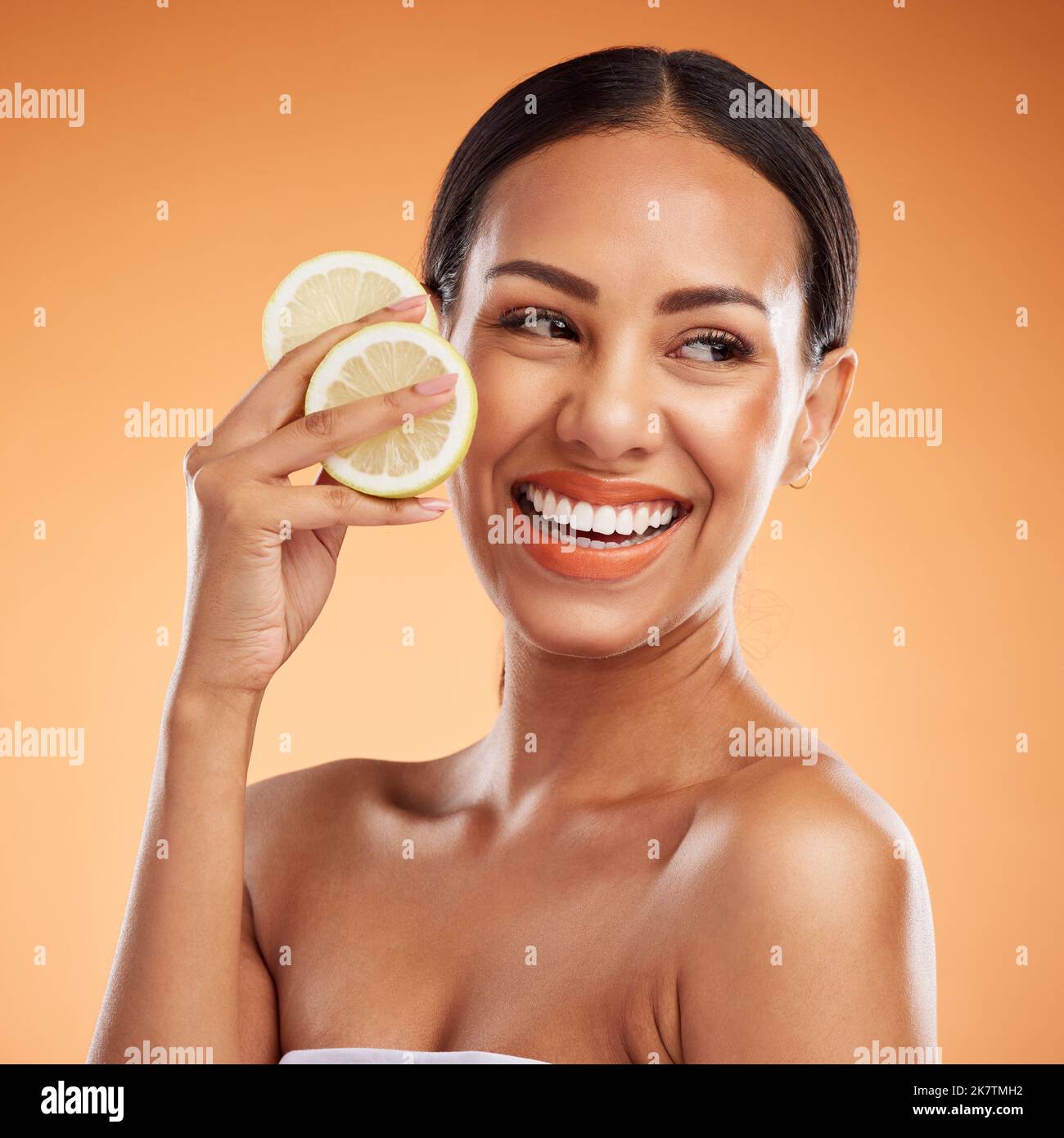 Face, skincare and woman with lemon for health, wellness and vitality ...