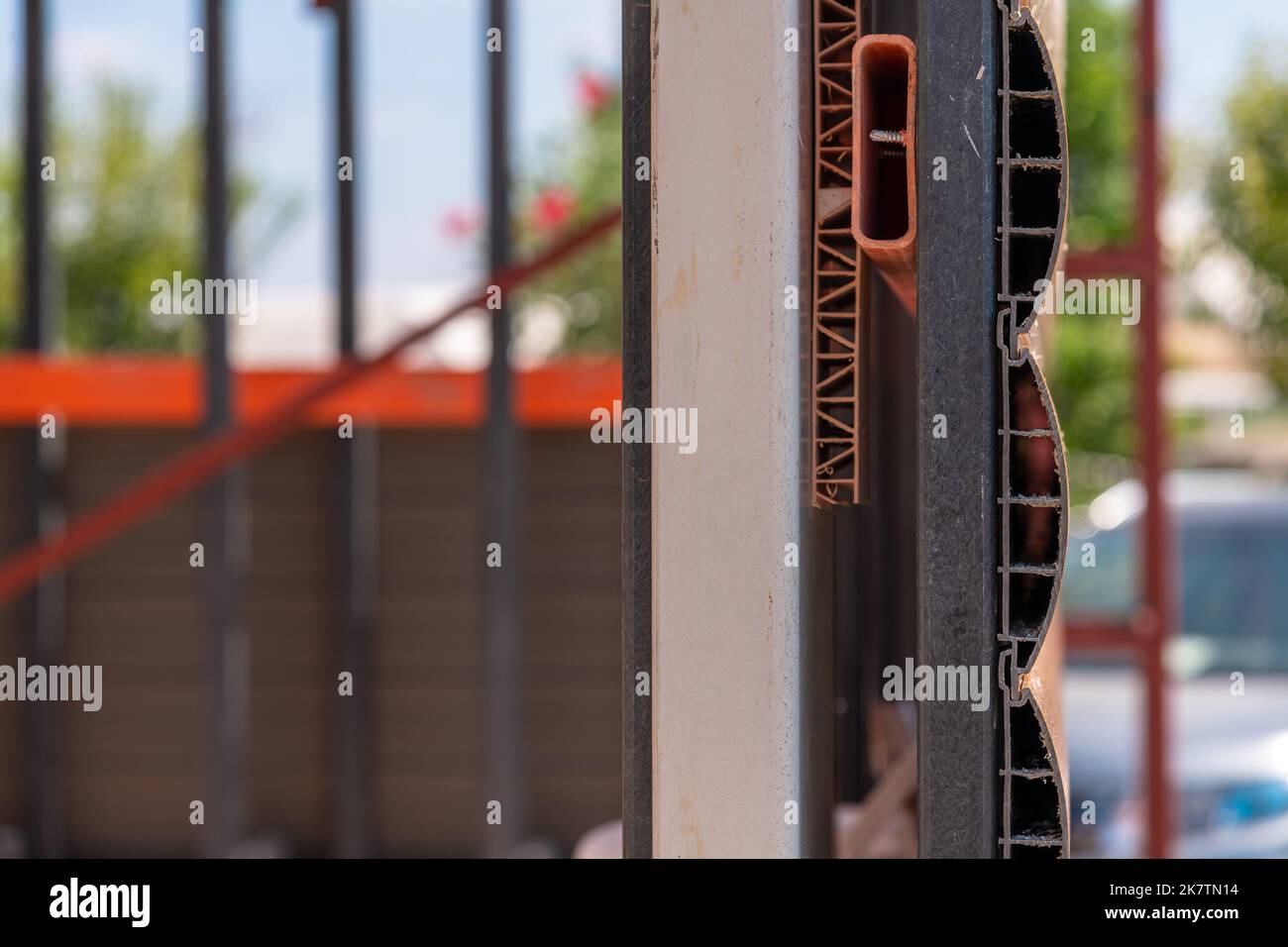 Facade cladding screwed into an iron profile to cover the exterior of a ...