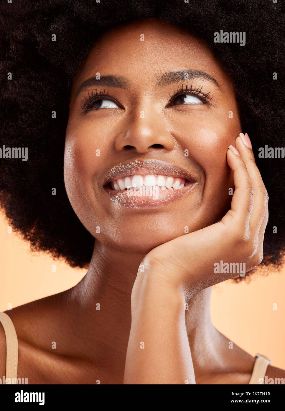 Face, beauty and skincare with a black woman thinking in studio on an ...