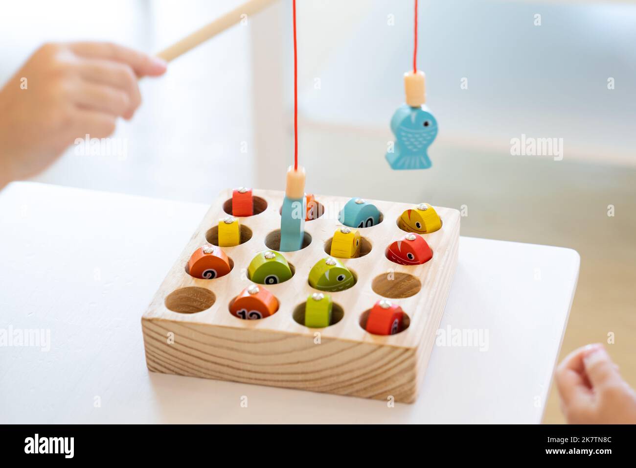 Kids are playing and finding the matched number in the wooden magnetic ...