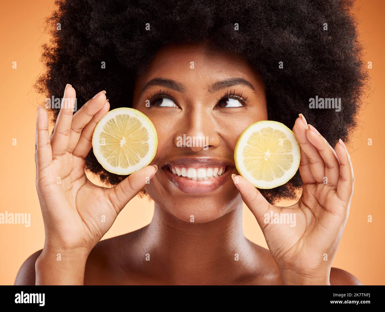 Beauty, skincare and black woman with lemon in hands and smile on face ...