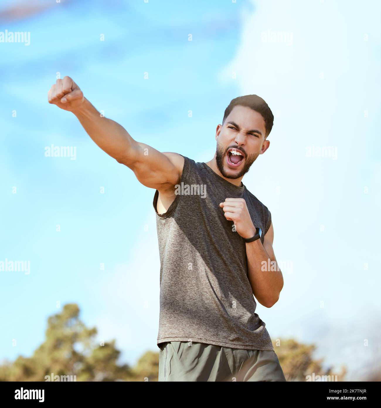 I dont need a weapon, I am one. Low angle shot of a sporty young man ...