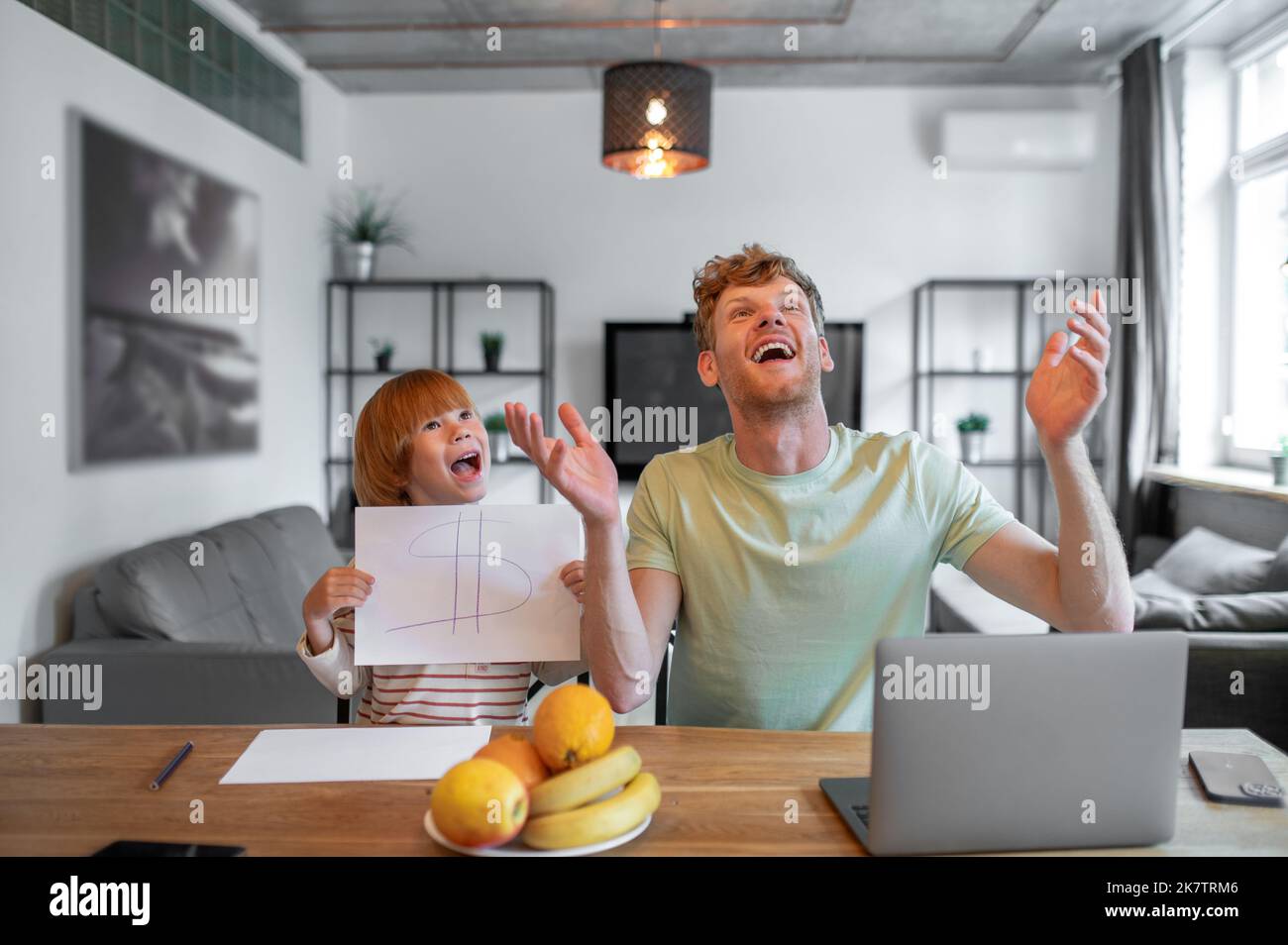 Father and son looking at paper hi-res stock photography and images - Alamy