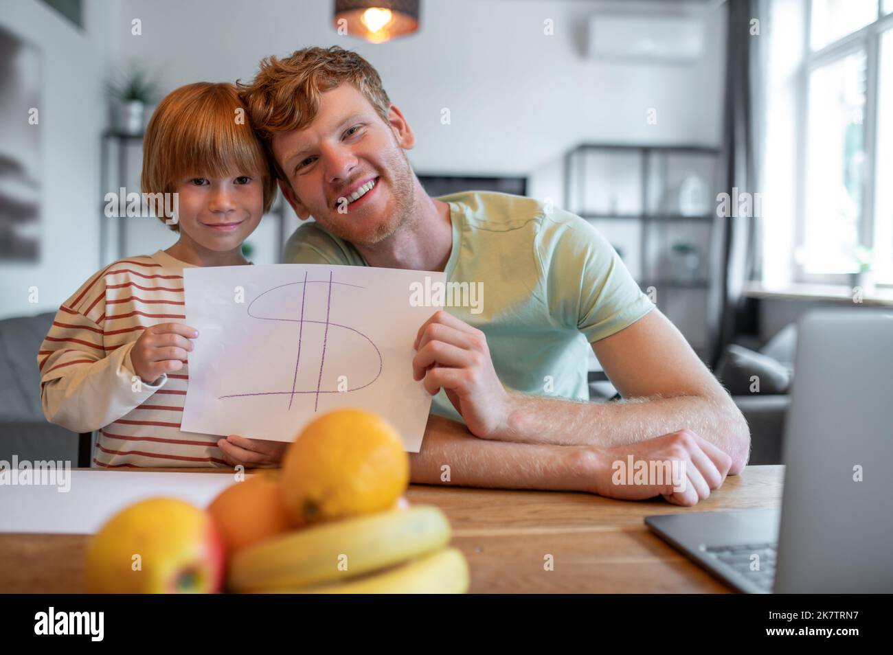 Dad and son feeling playful and looking happy Stock Photo - Alamy