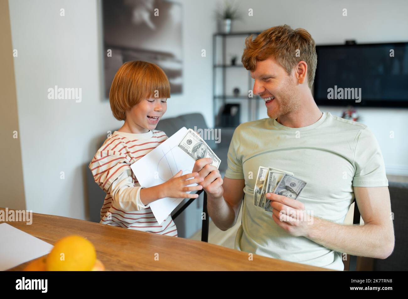 Ginger man and his son spending time together and having fun Stock ...