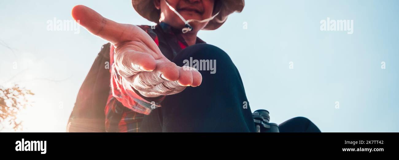 Hiker man giving a helping hand, Hands reaching out to help each other ...