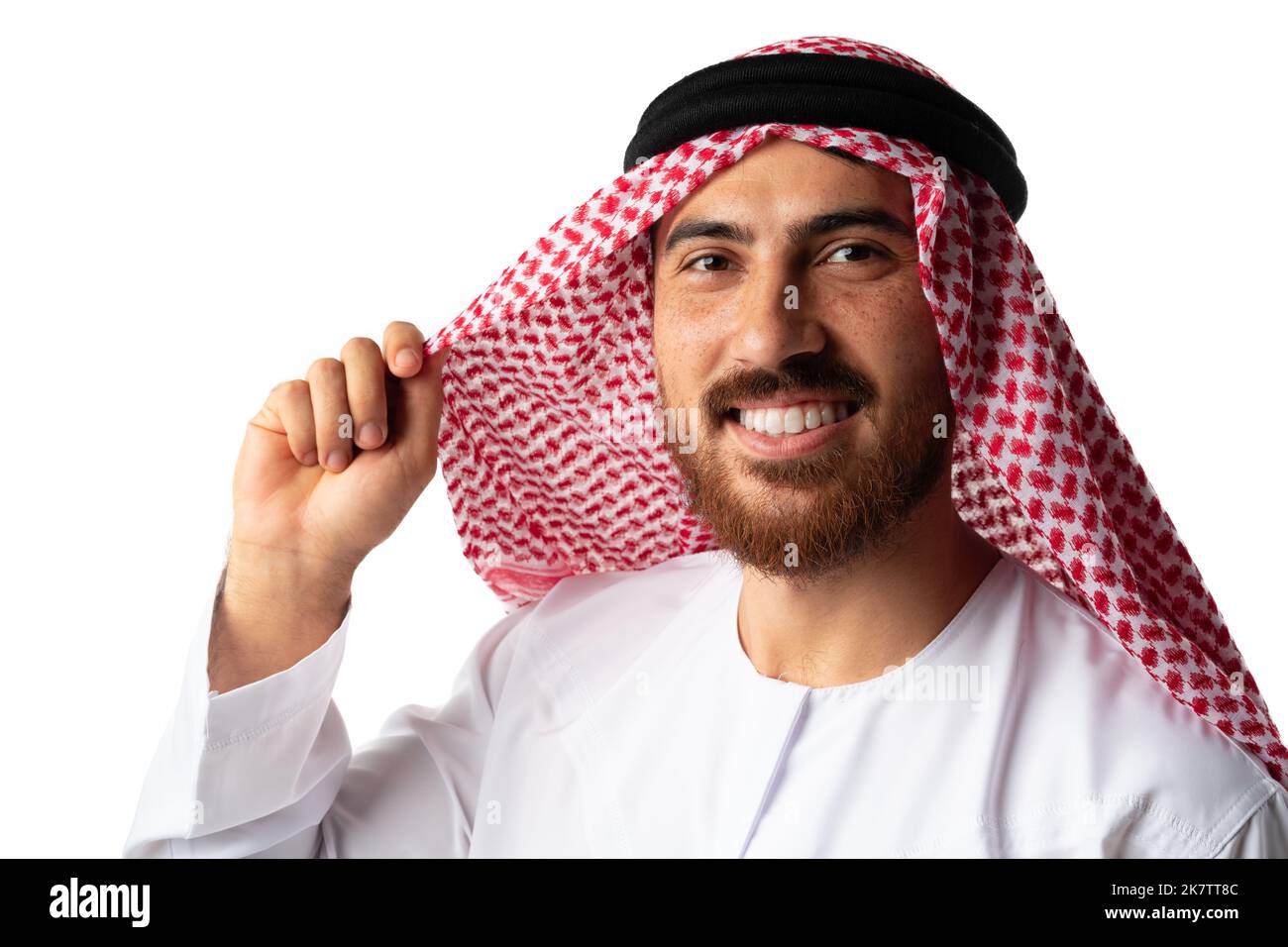 Smiling arab man while standing in a white studio Stock Photo - Alamy