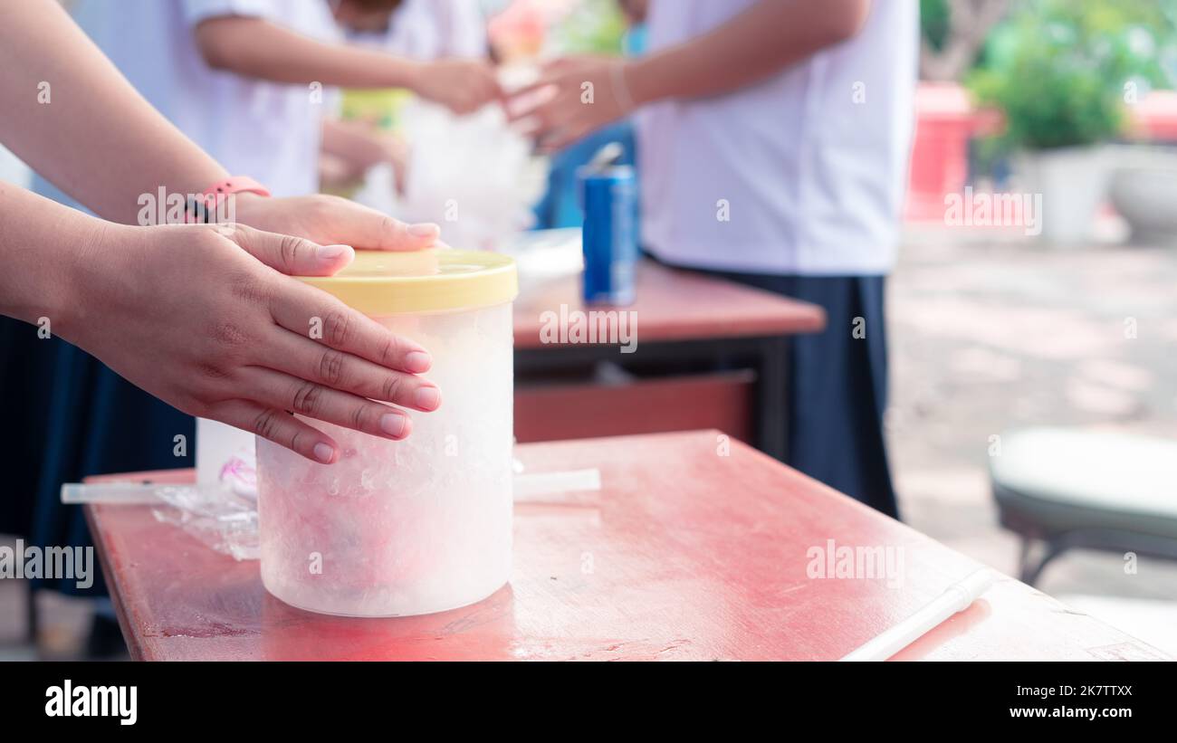 Students are experimenting with super cooling using ice and salt Stock ...