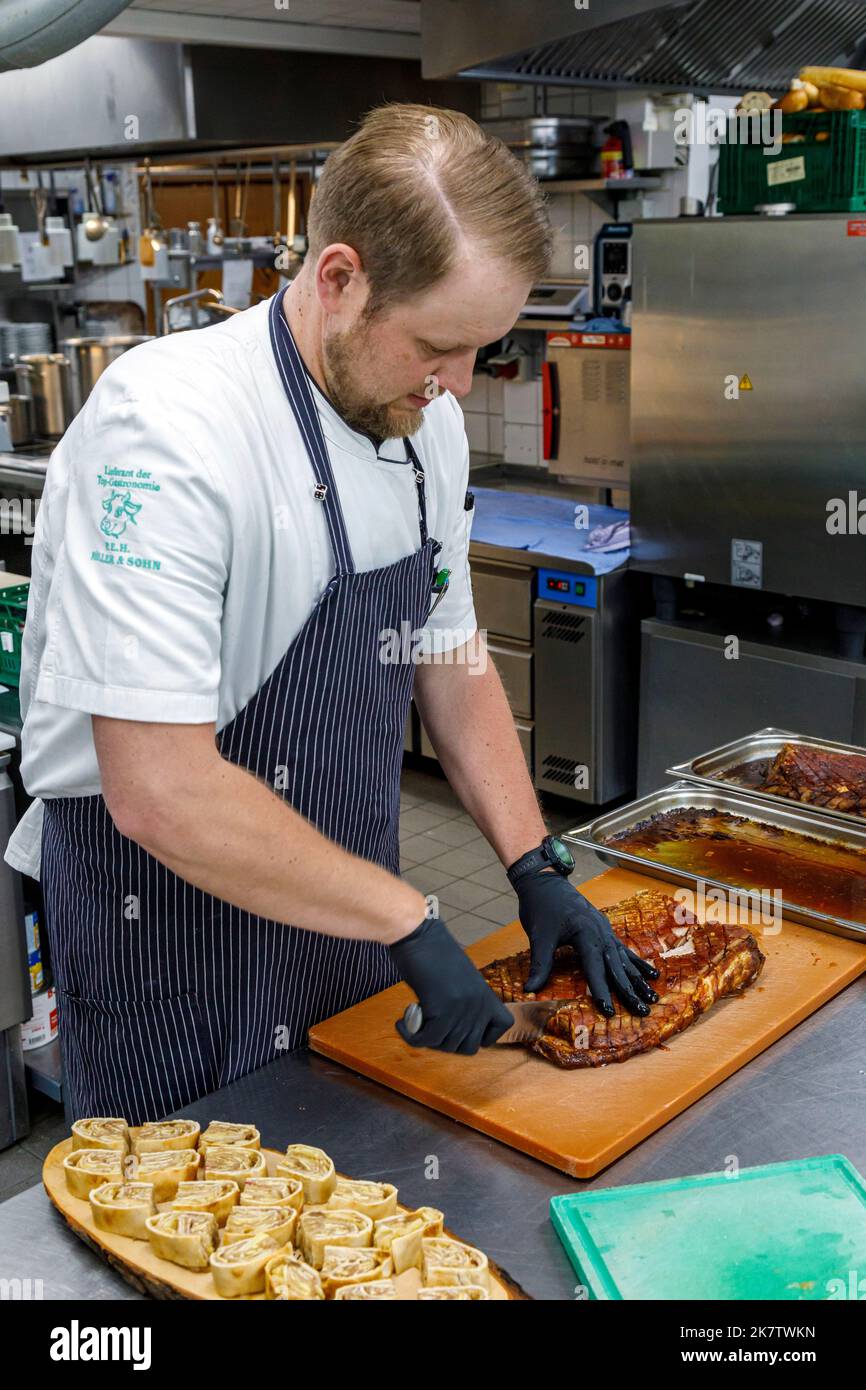 Chef preparing food in a professional kitchen Stock Photo - Alamy