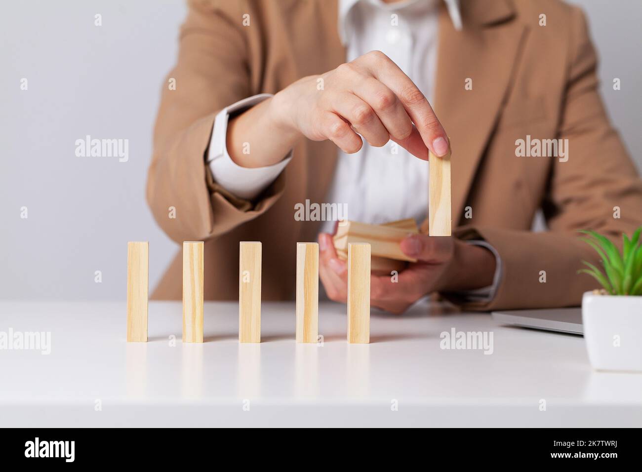 Close up woman's hand stacked wooden blocks on desk Stock Photo - Alamy