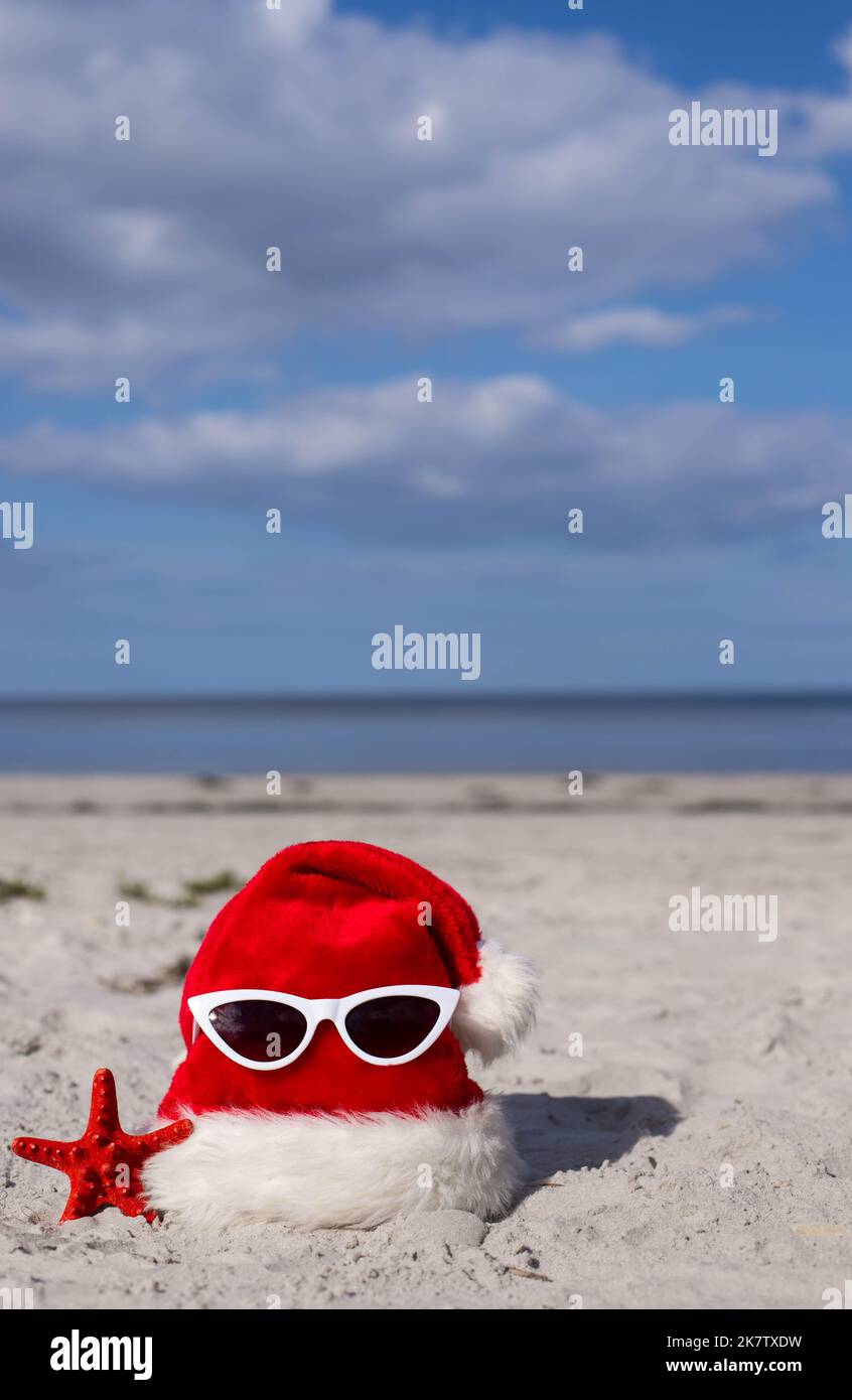Santa Claus hat,starfish and sunglases on the beach Stock Photo - Alamy