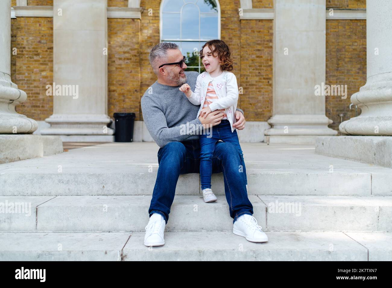 Daughter on fathers lap hi-res stock photography and images - Alamy