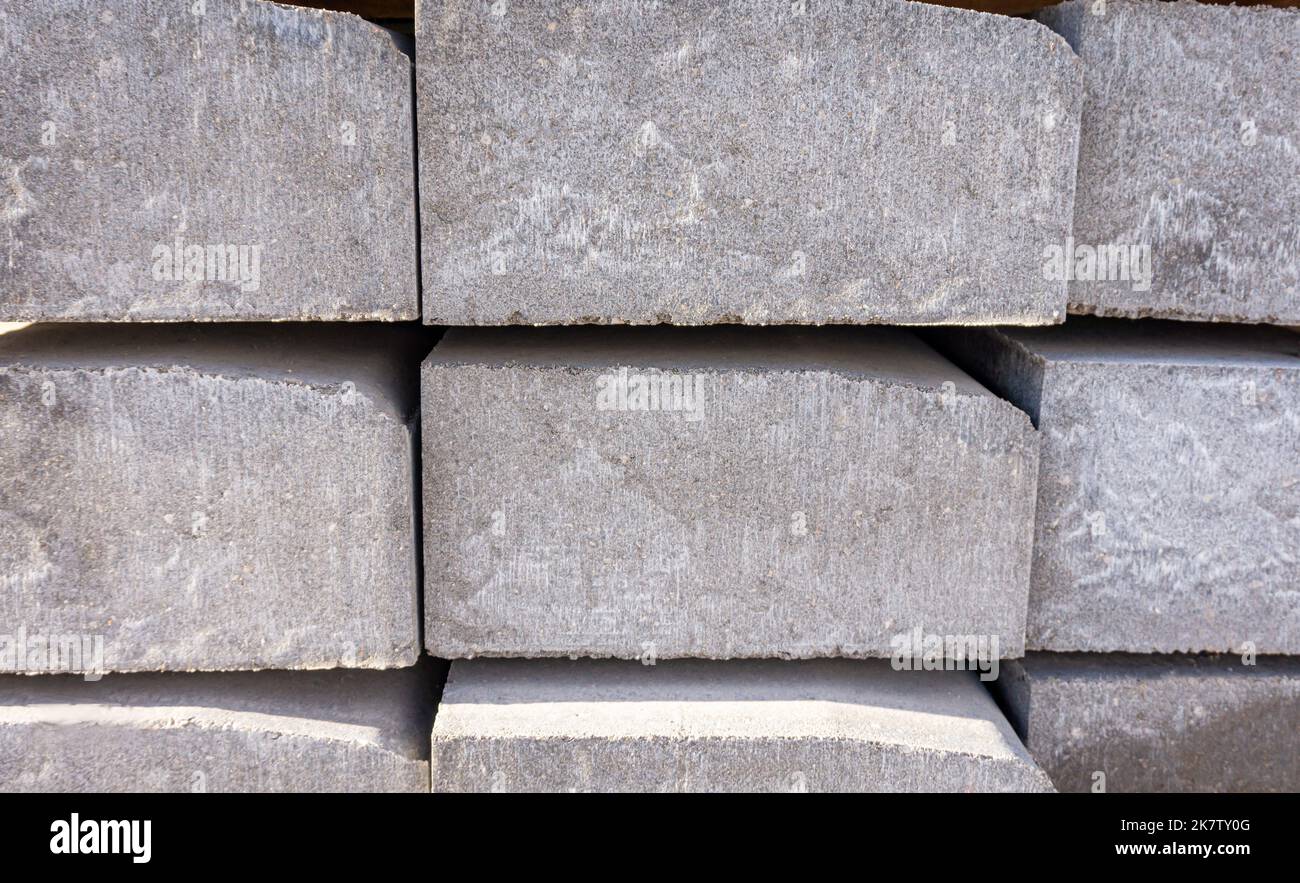 Stack of concrete curb stones, road construction materials close-up ...