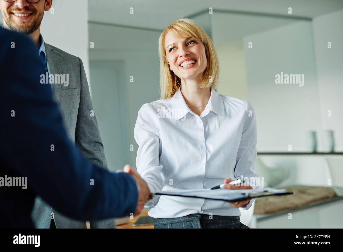 young business businesswoman handshake hand shake shaking meeting agreement office teamwork ...