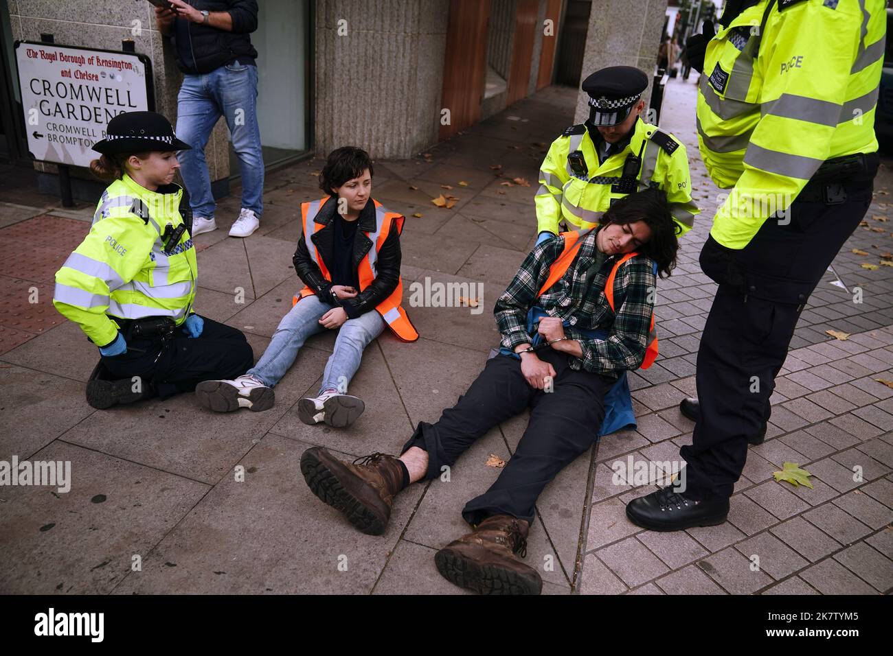 Police remove activists from Just Stop Oil during their protest on ...