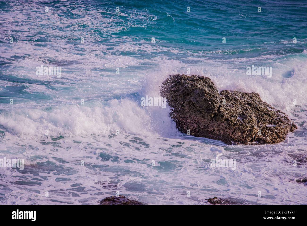 Sea spray and foam, rock and waves, ocean scenery on paradise island ...