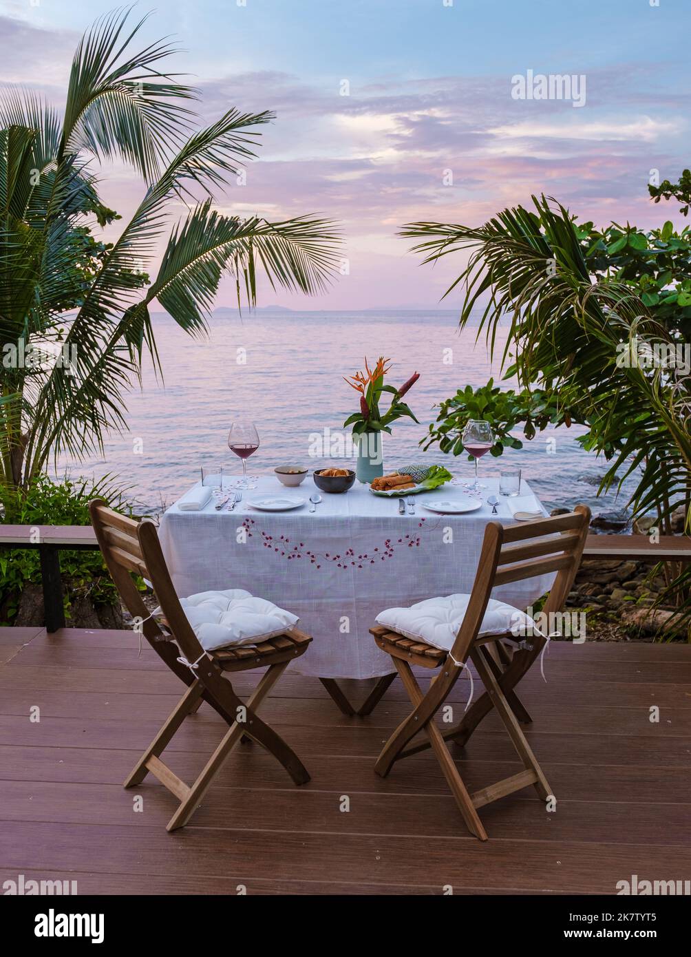 dinner table looking out over the ocean with Thai food, dinner during ...