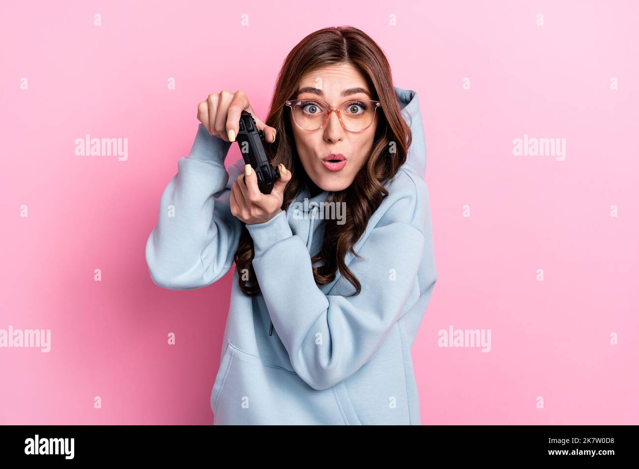 Portrait of shocked gamer person pouted lips hold controller play video ...