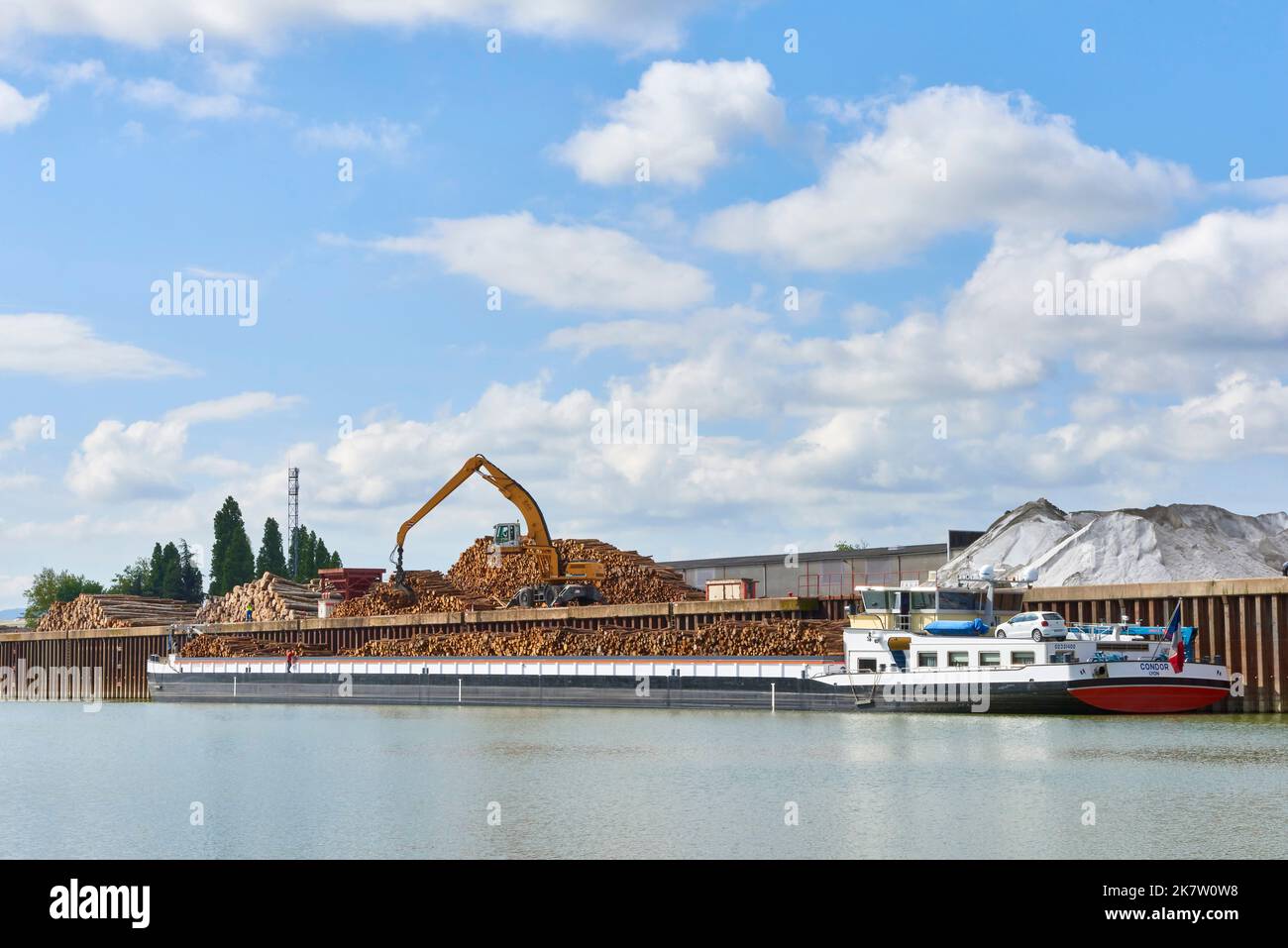 Large barge “Le Condor” loaded with wood in the river port of ...
