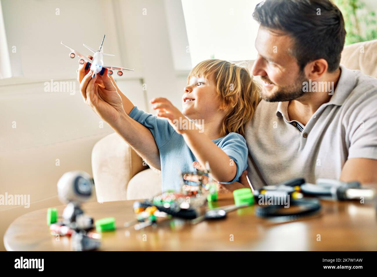 child son father family happy playing kid childhood dad love fun smiling little man home toy ...