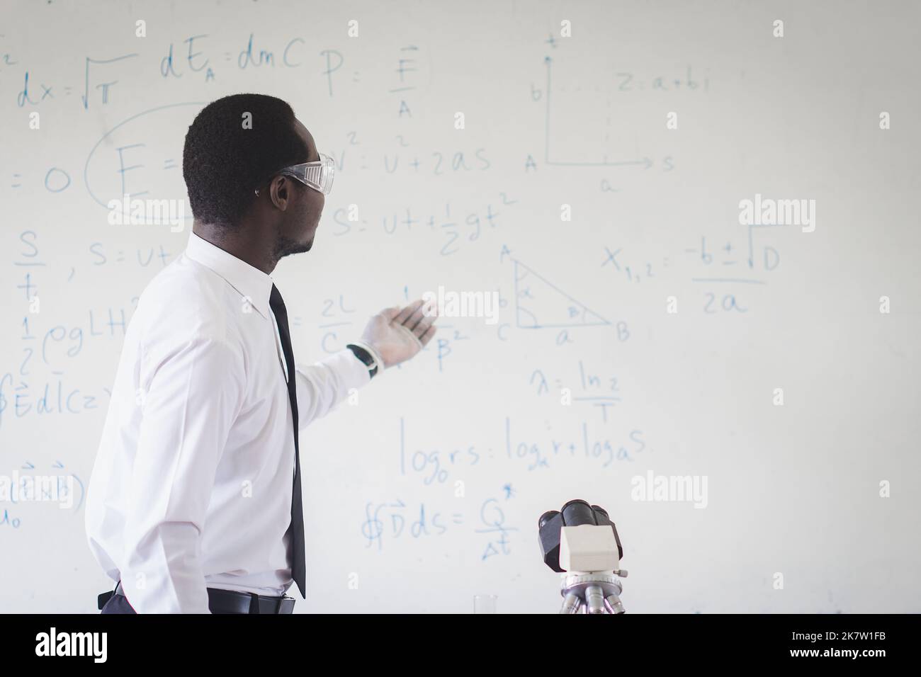 African teacher is explaining science lessons inside the classroom with ...