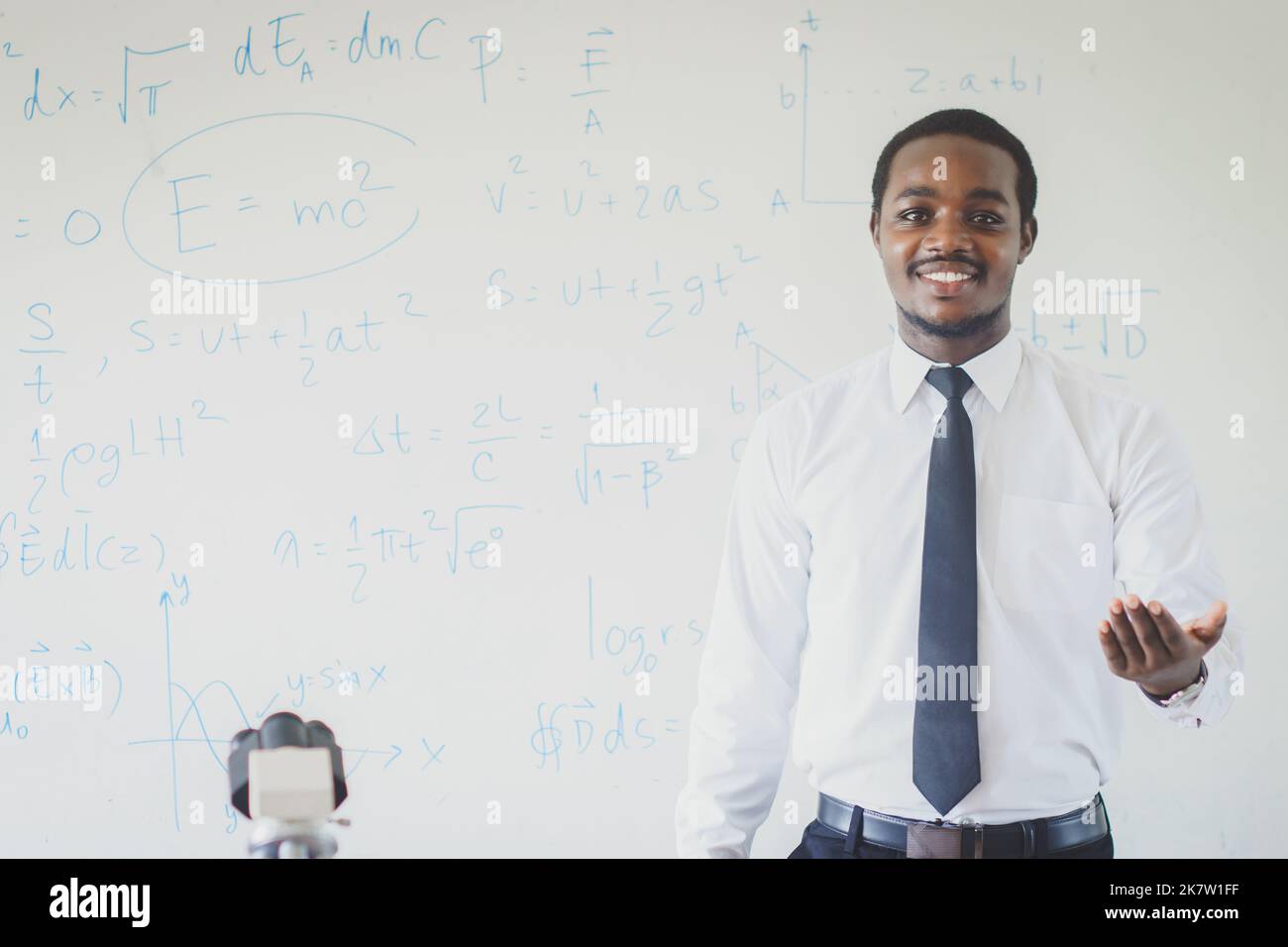 African teacher is explaining science lessons inside the classroom with ...