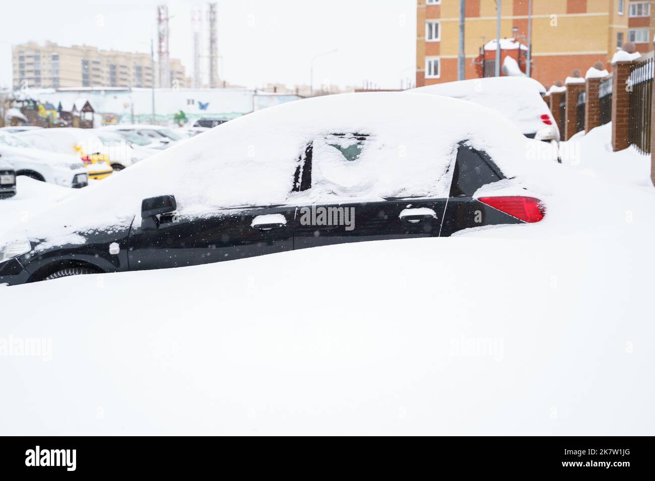 Russia Moscow 13.02.2021 Cars on street covered with snow. City winter ...