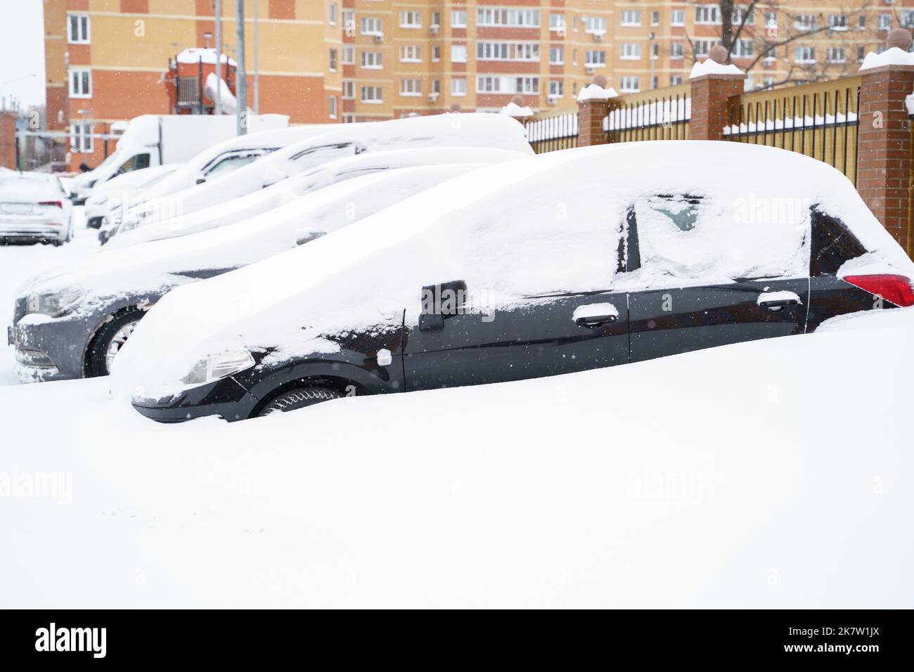 Russia Moscow 13.02.2021 Cars on street covered with snow. City winter ...