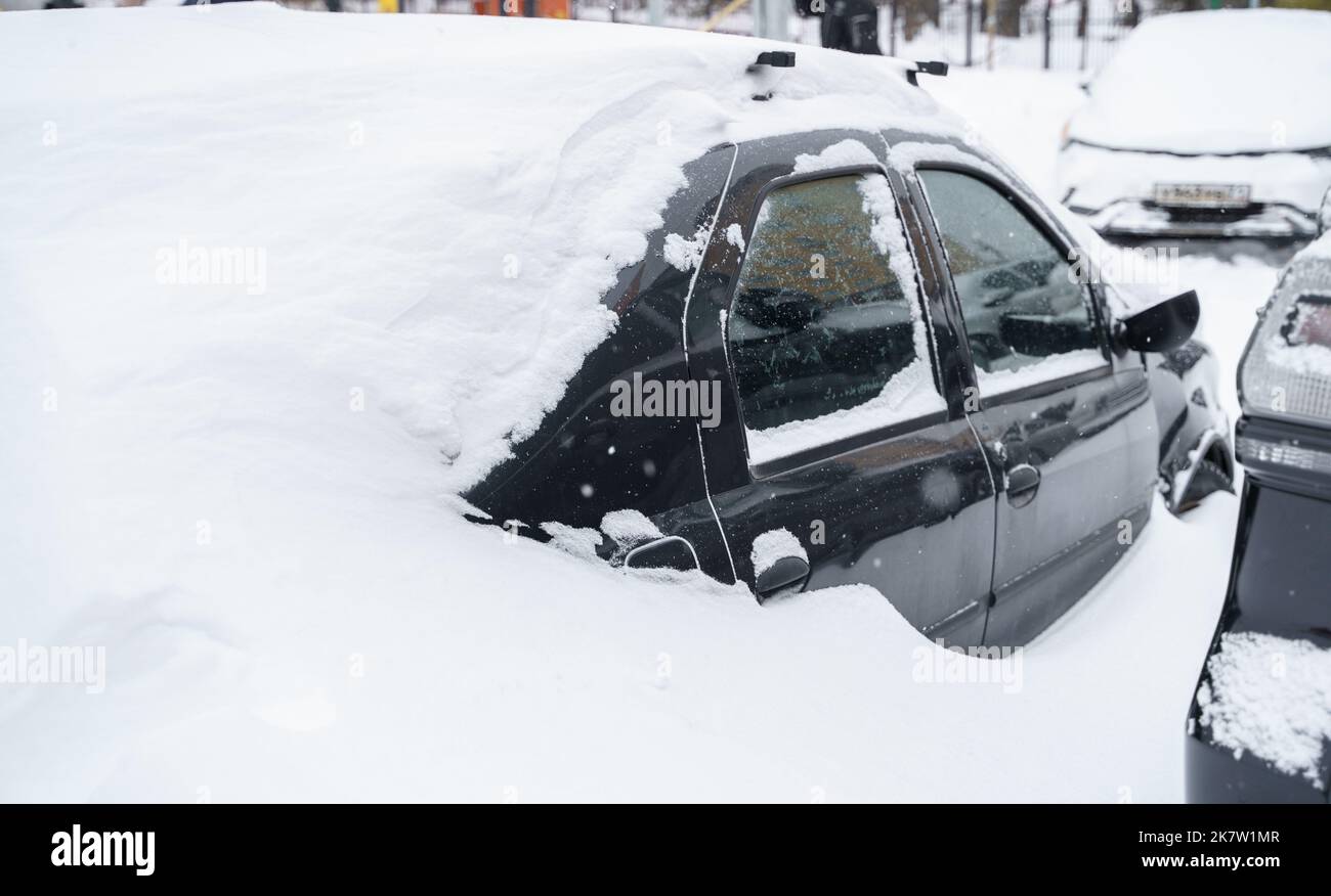 Russia Moscow 13.02.2021 Cars on street covered with snow. City winter ...