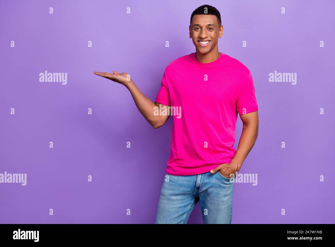 Portrait of cheerful satisfied sincere man fade haircut wear pink t ...