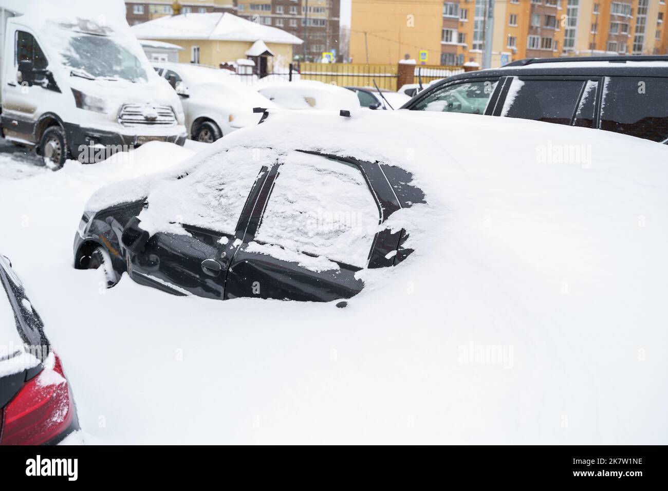 Russia Moscow 13.02.2021 Cars on street covered with snow. City winter ...