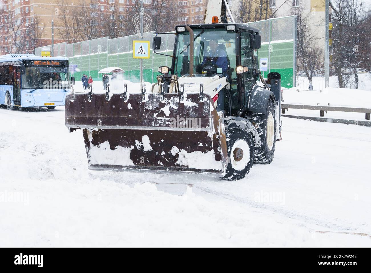 Russia Moscow 13.02.2021 Tractor, snow removal equipment. Street ...